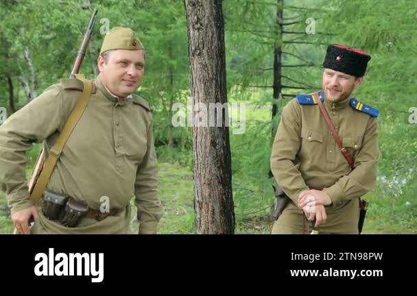 The army of the USSR. Soviet army soldiers are resting. Soldiers listen ...