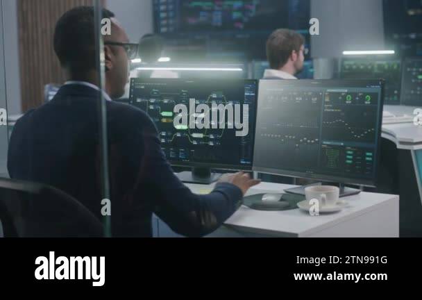 African American big data scientist works at computer in monitoring ...