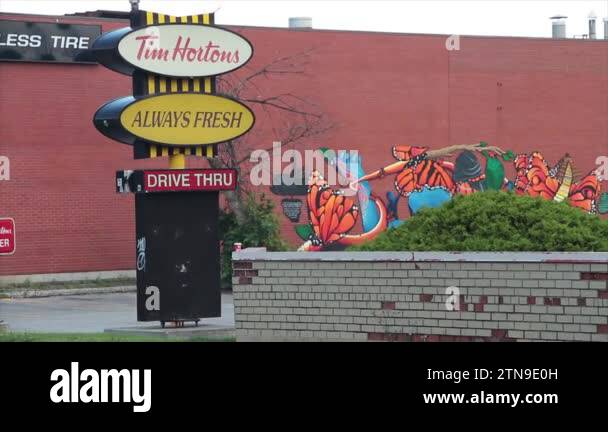 vintage tim hortons always fresh drive thru signs with mural on brick ...