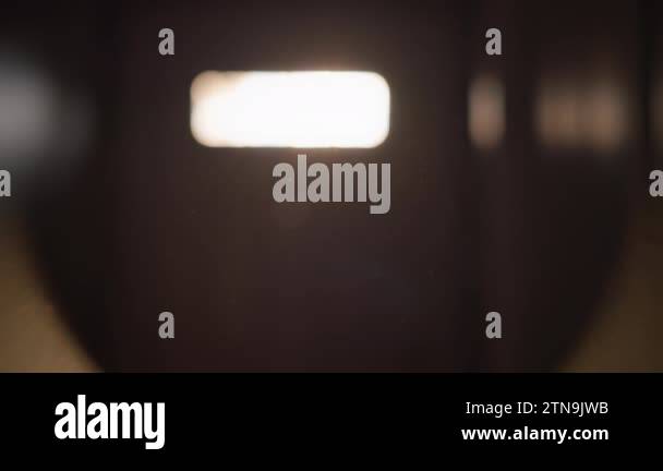 Dust particles floating in a sunlight ray from the window creating lens ...