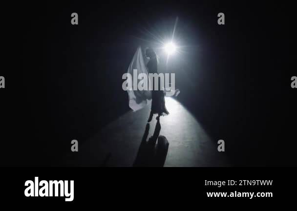 Woman dancing modern dance at smoky stage with spotlights. Contemporary ...