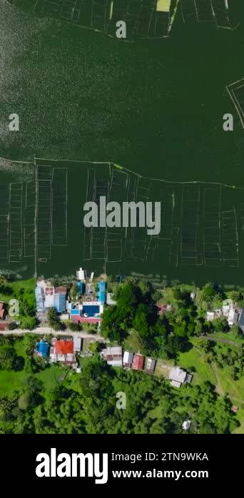 Top down view of Lake Sebu with sunlight reflection on water with fish ...