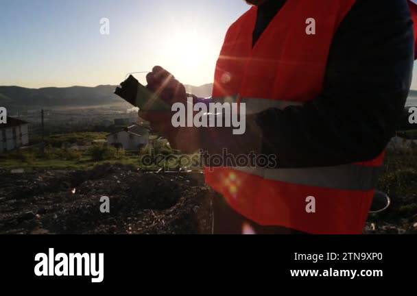 Surveyor performing geodesic measurements on top of the mountain Stock ...