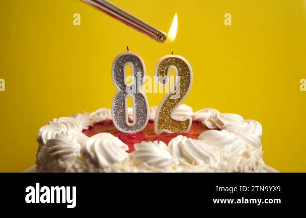 A candle in the form of the number 82, inserted into the holiday cake ...