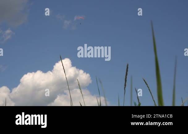 Paragliding.high Flying Glider in the Sky.shooting With Grass Level ...