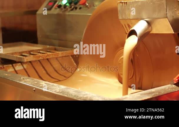 liquid chocolate Stirring with pre-made bars of chocolate, tempering it ...