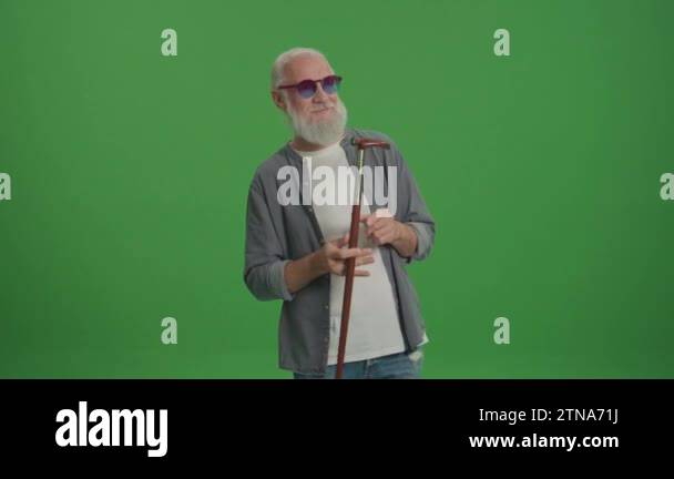 Green Screen. A Happy Old Man in the Funny Glasses Dancing with a Stick ...