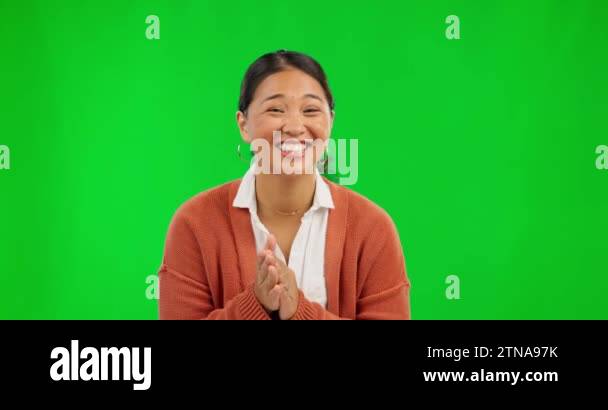 Asian woman, applause and thumbs up for good job on green screen in ...