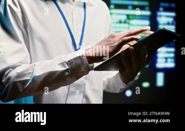 Admin in cloud computing business walking through server clusters used ... Admin in cloud computing business walking through server clusters used ...