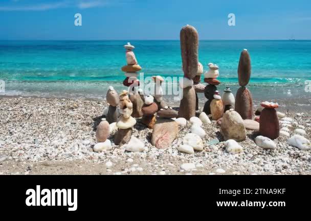 Concept of balance and harmony. Stones pebbles stacks on beach coast of ...