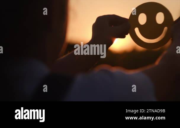 Selective focus of little girl kid holding yellow happy smile face on ...