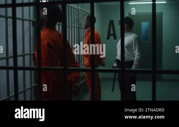 Bars in front prison Stock Videos & Footage - HD and 4K Video Clips - Alamy