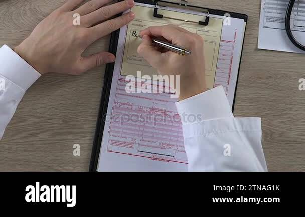 Doctor prescribing drugs, writing in prescription form, patient ...