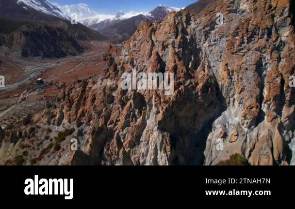 Aerial revealing view scenic valley with mountain villages and snowy ...