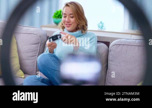 Gaming, entertainment and woman gamer on a sofa relaxing in the living ...