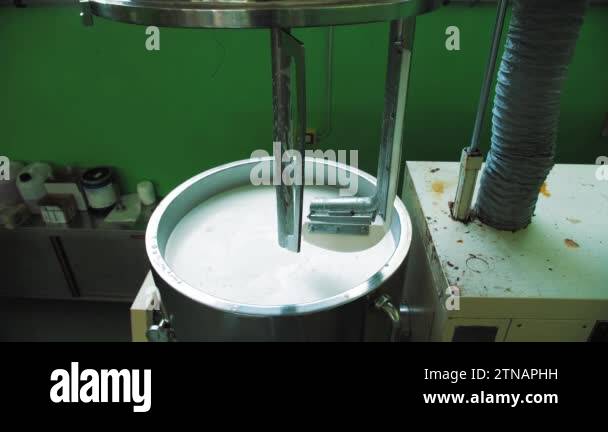 Cream vacuum mixing vessel opening and closing the lid. Automatic ...