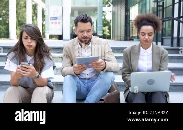 Quick briefing before meeting. Group of cheerful young successful ...