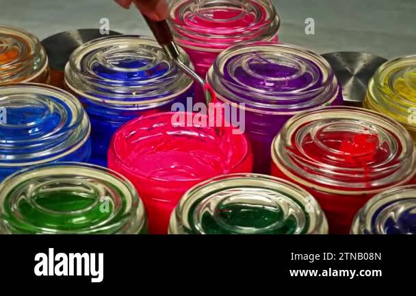 Use a trowel to stir the pink paint in a glass jar before use..This ...