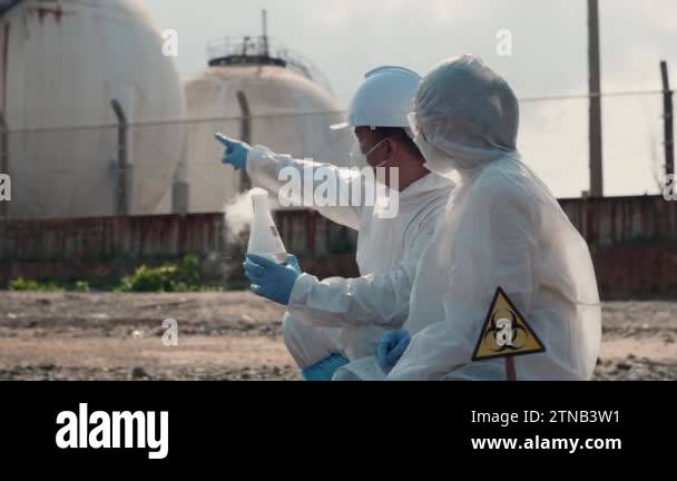 Ecologist sampling water from river with test tube glass and have white ...