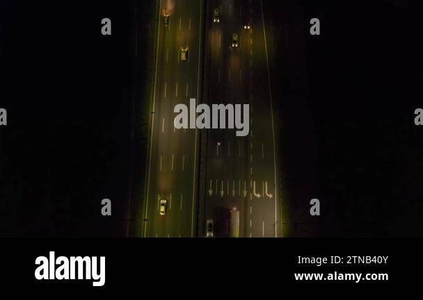 Cinematic Overhead top view, Cars moving on the highway straight road ...