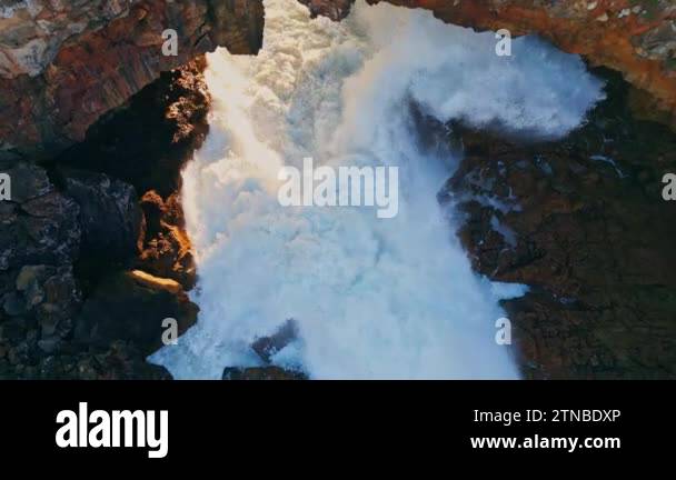Aerial huge waves crashing on rocky shore super slow motion ...