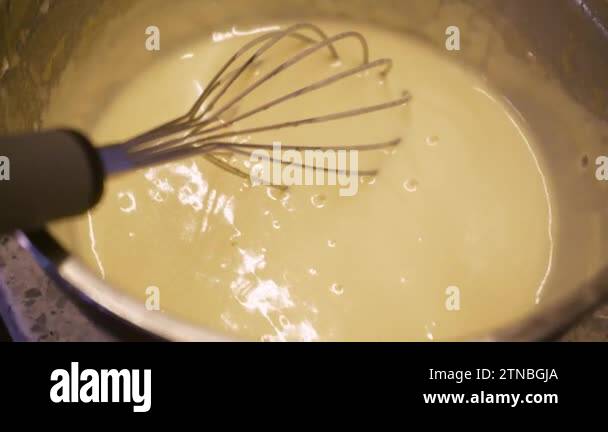 Cooking Belgian waffles in a waffle maker in a cafe. Close-up of a chef ...
