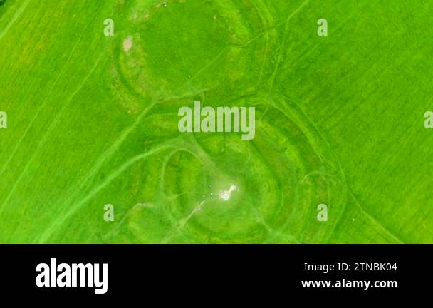 Aerial rotating top-down view of the Hill of Tara, an archaeological ...