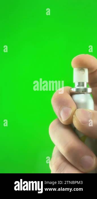 spray can man presses a button on an aerosol can, releasing chemicals ...