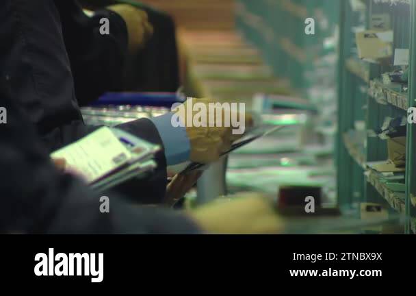 Mail Sorting Office, Mail Staff Working inside a Postal Sorting Office ...