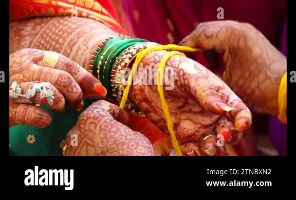 Ceremony of Wearing Turmeric Thread on hand of bride. Marathi Wedding ...