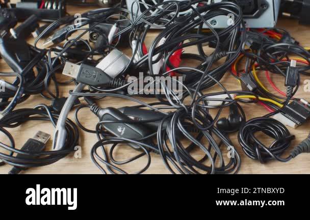Bunch of old wires, connections, headphones and chargers for electronic ...