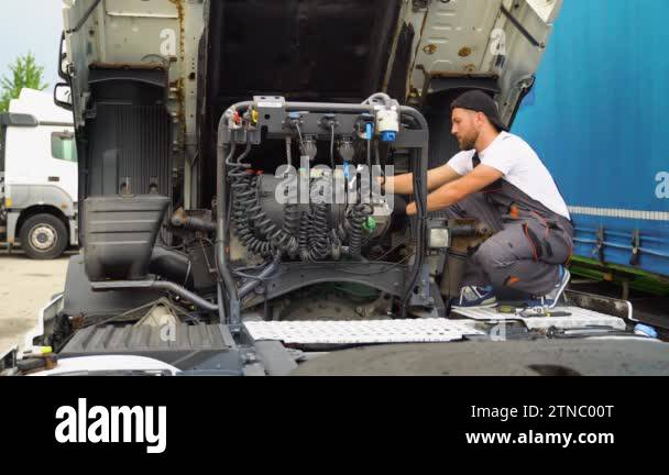 Mechanic repairing truck diesel engine Stock Videos & Footage - HD and ...