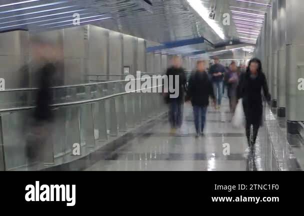 Interior of a modern subway station with transfer corridor timelapse ...