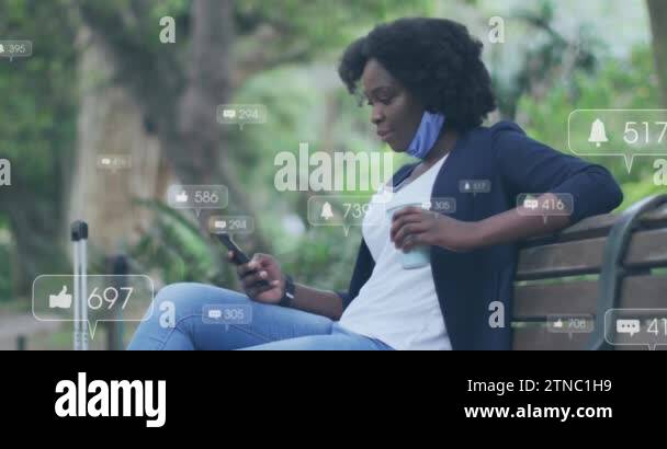 Animation of social media icons over african american woman using ...