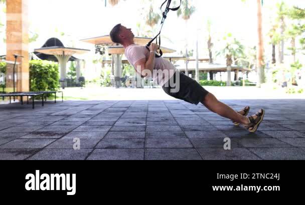 Muscular athletic powerful bodybuilder, athlete using sports equipment ...