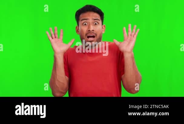 Shocked, scared and face of man on green screen for fear, horror and ...