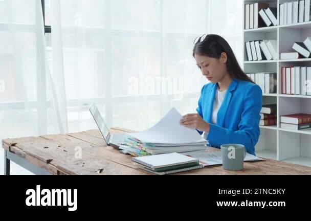 burnout syndrome, paperworks stress, Asian white office worker searching documents on desk ...