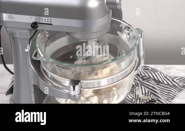 Step by step. Mixing ingredients in kitchen mixer to bake homemade ...