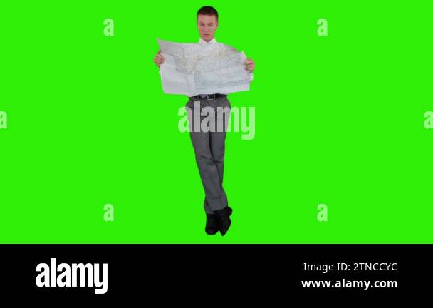 Young businessman reading a map and sitting, Green Screen Stock Video ...
