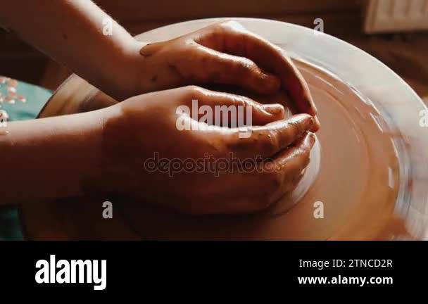 Creating a clay pot.Gonchar.Potter.A turner.Workshop of clay.Clay on the device.Master.Hands ...