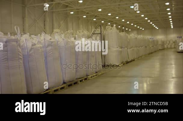Warehouse for storage of fertilizers in bags. stack of big bag contain ...