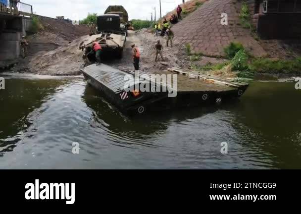Pontoon bridge of the Ukrainian army. Installation of a temporary ...