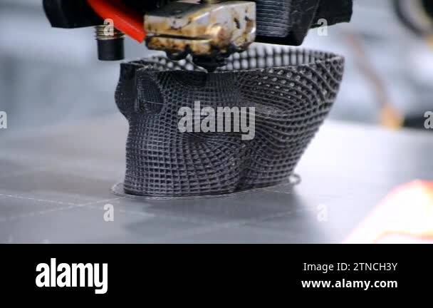 3D printer printing prototype of human skull from molten plastic ...