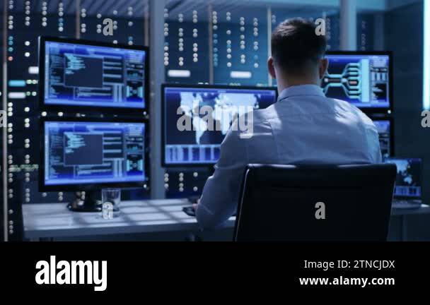 Back View of Technical Controller/ Operator Working at His Workstation ...