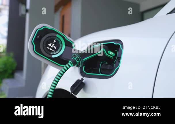Electric car recharging in futuristic home charging station with smart ...