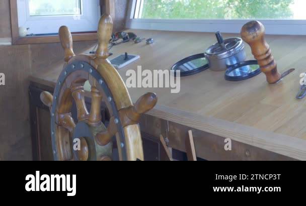 Close view into captains cabins, navigation equipment and captains hand ...