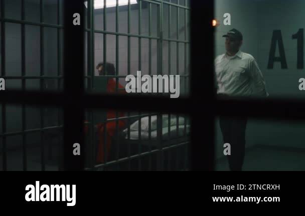 Jailer walks the corridor. Male prisoner hits prison officer, opens ...