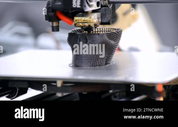 3D printer printing prototype of human skull from molten plastic ...