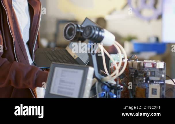 Boy Works on a Fully Functional Programable Robot with Bright LED ...