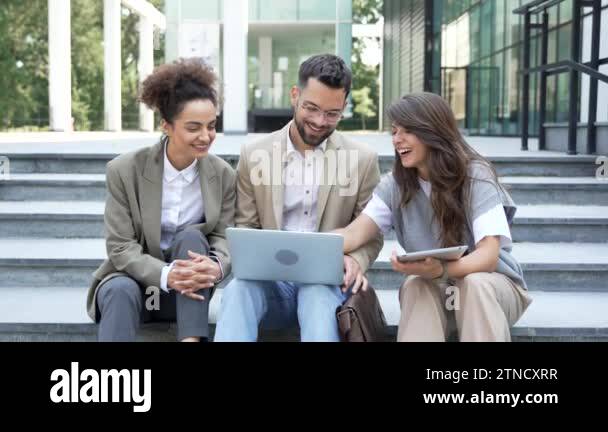 Quick briefing before meeting. Group of cheerful young successful ...
